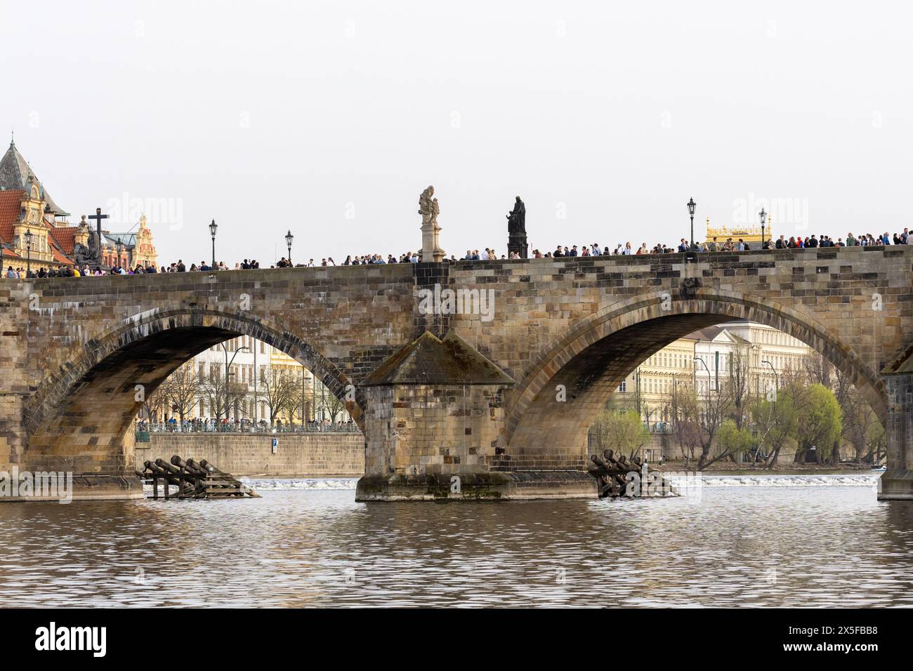 Prague, czech republic - Mar 3 2024: Tourists walking on Charles bridge ...