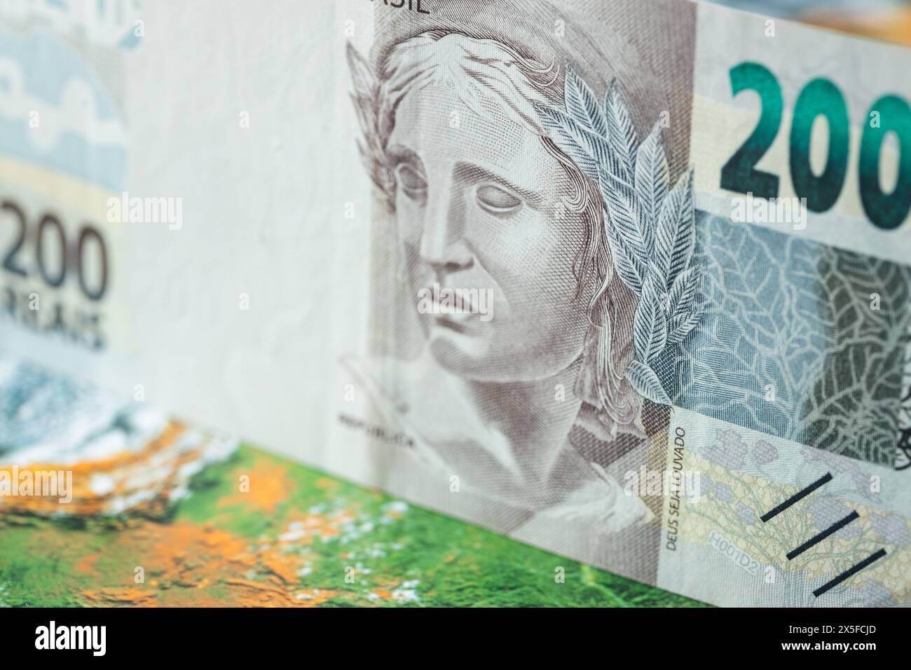 Brazilian money, 200 reais banknote on world background, Brazilian ...