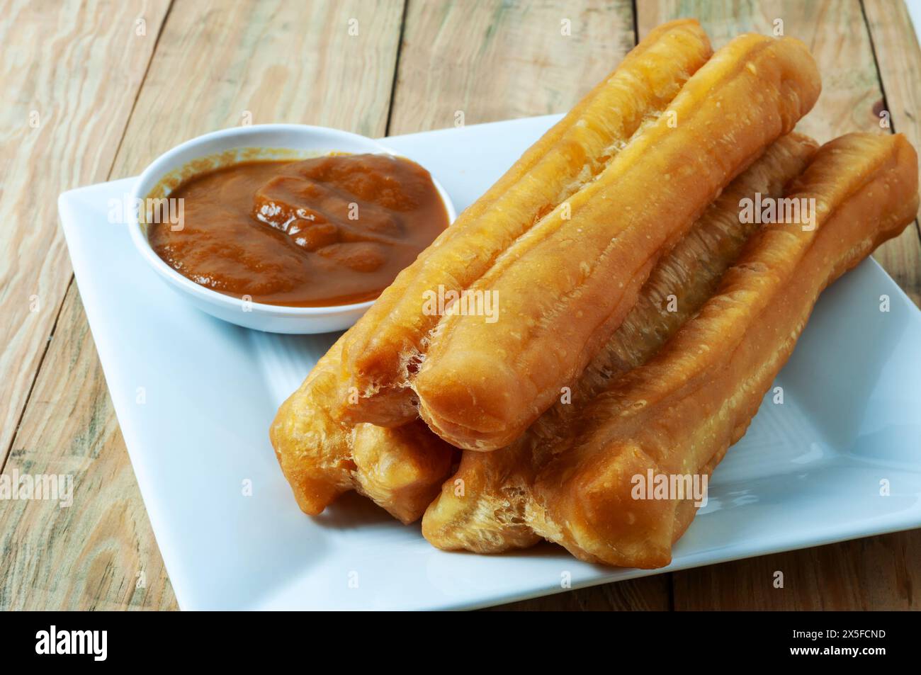 Deep fried Youtiao Chinese fried breadstick and kaya coconut jam Stock ...