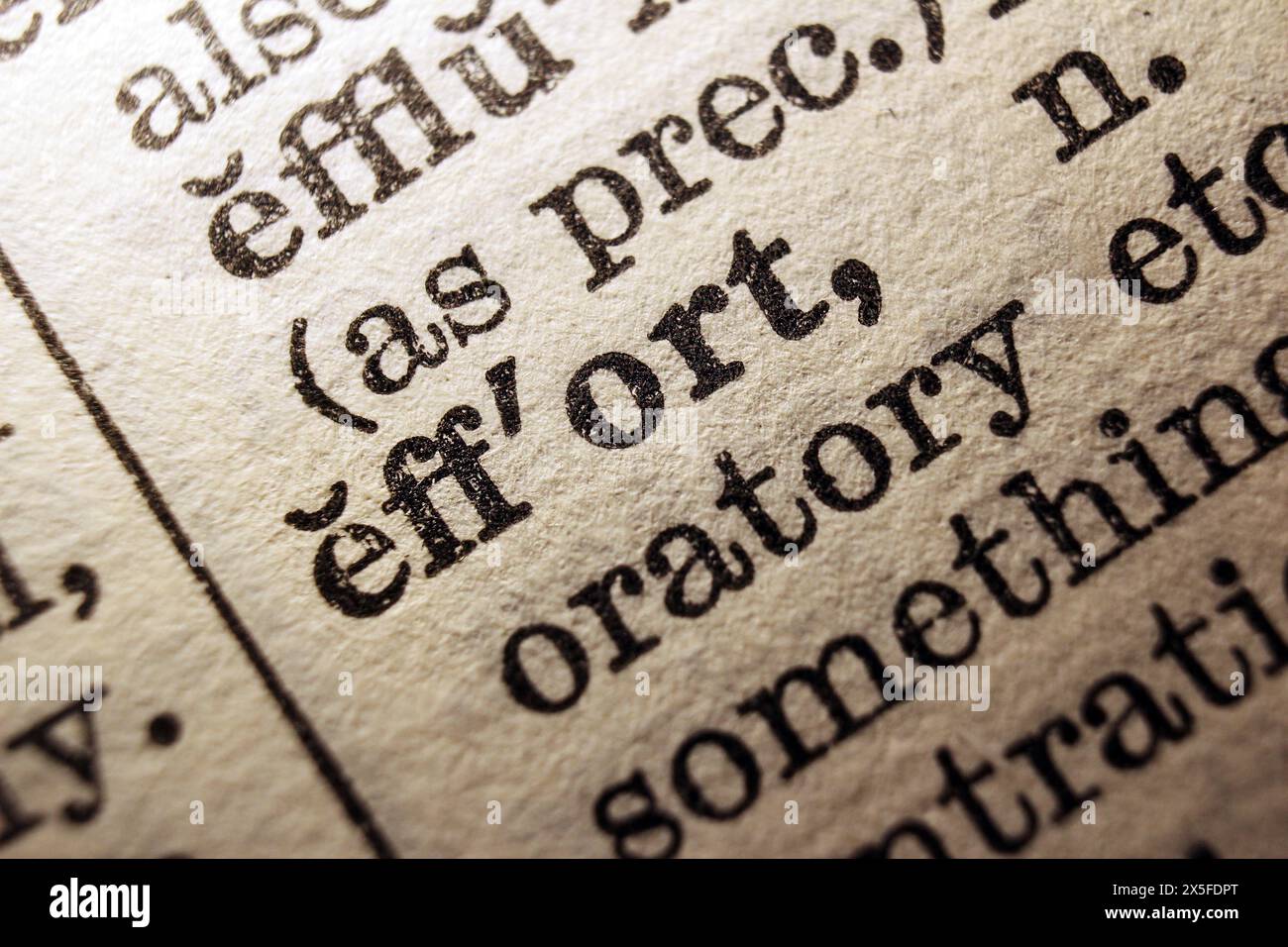 Word effort on dictionary page, macro close-upperseve Stock Photo - Alamy