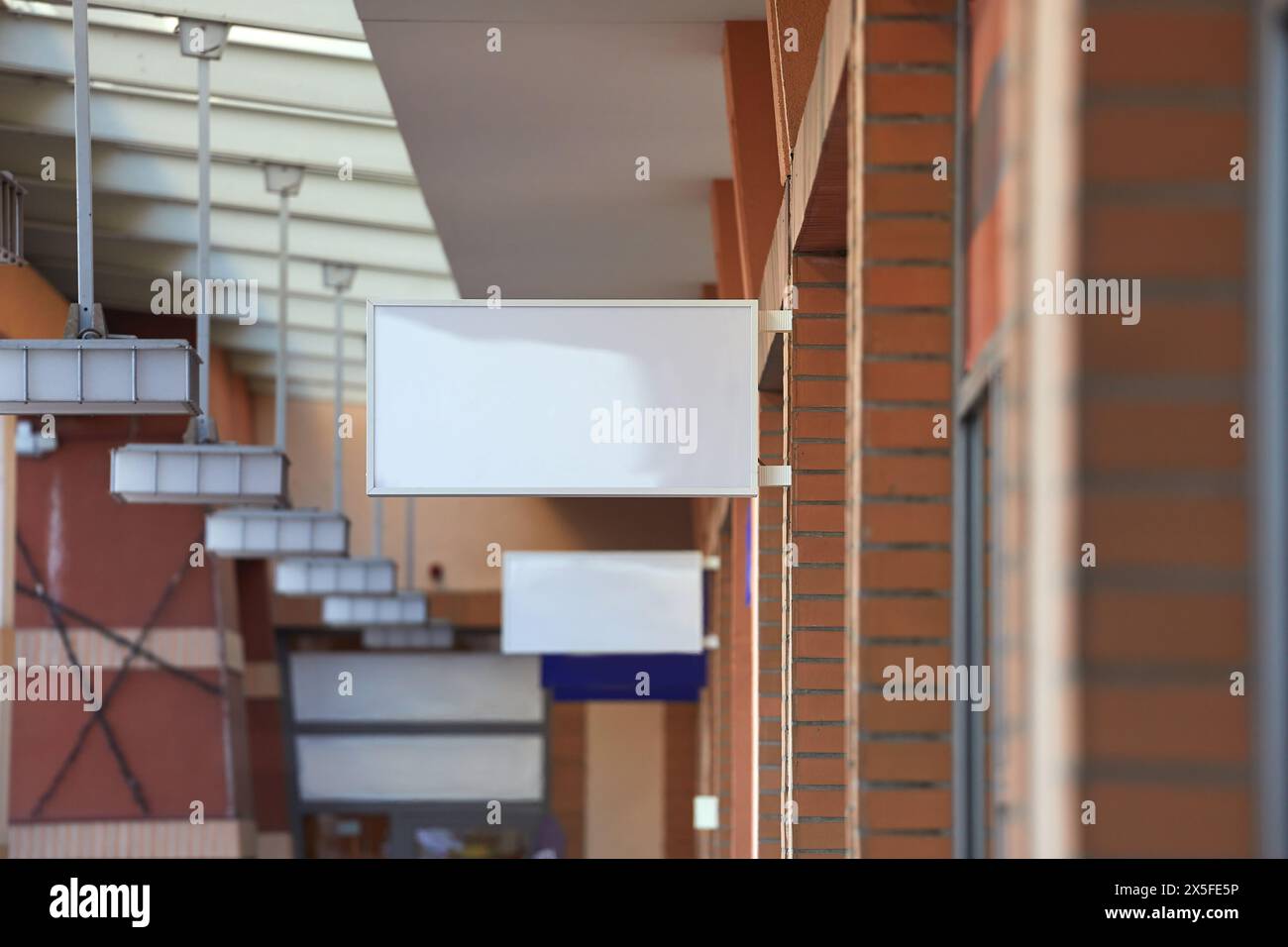 Generic shop sign in mall, blank white Stock Photo - Alamy