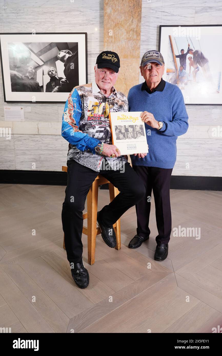 Mike Love (left) and Bruce Johnson at a reception and private view at ...