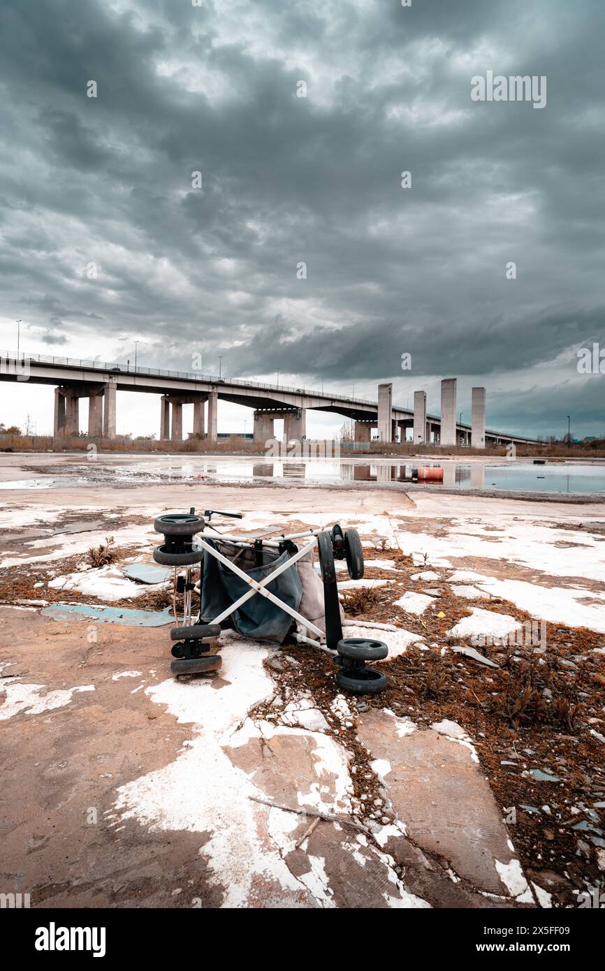 depiction of bleak dereliction and emptiness child's pram lying on its ...
