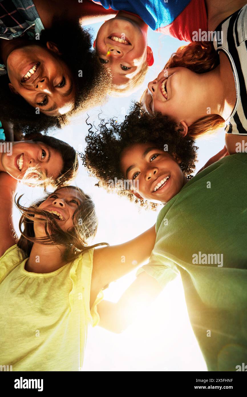 Happy, huddle and circle of children in park for bonding, playing and ...