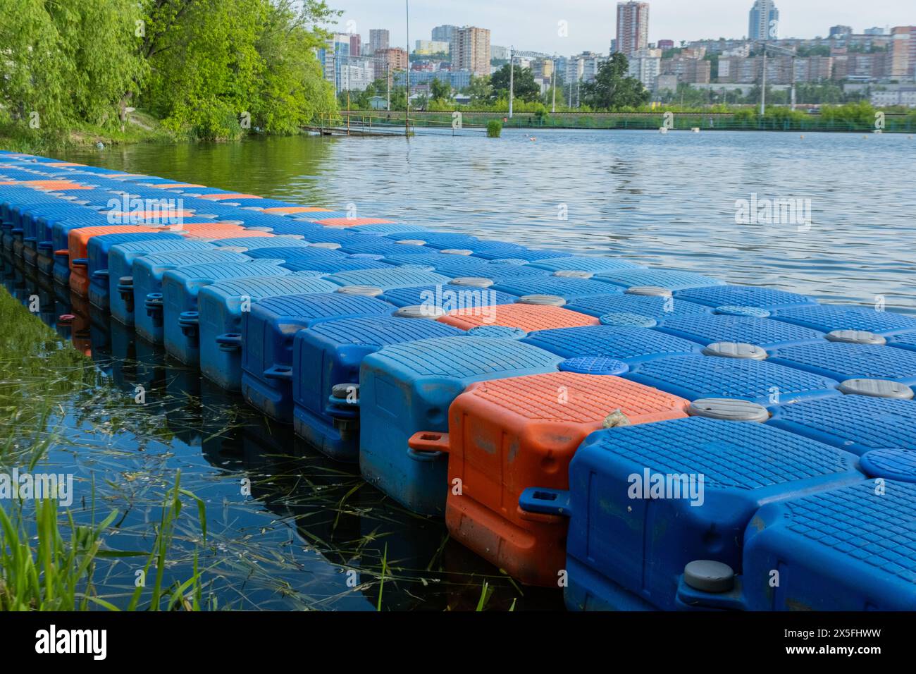 Floating pier made of composite plastic blocks on the river, sea ...