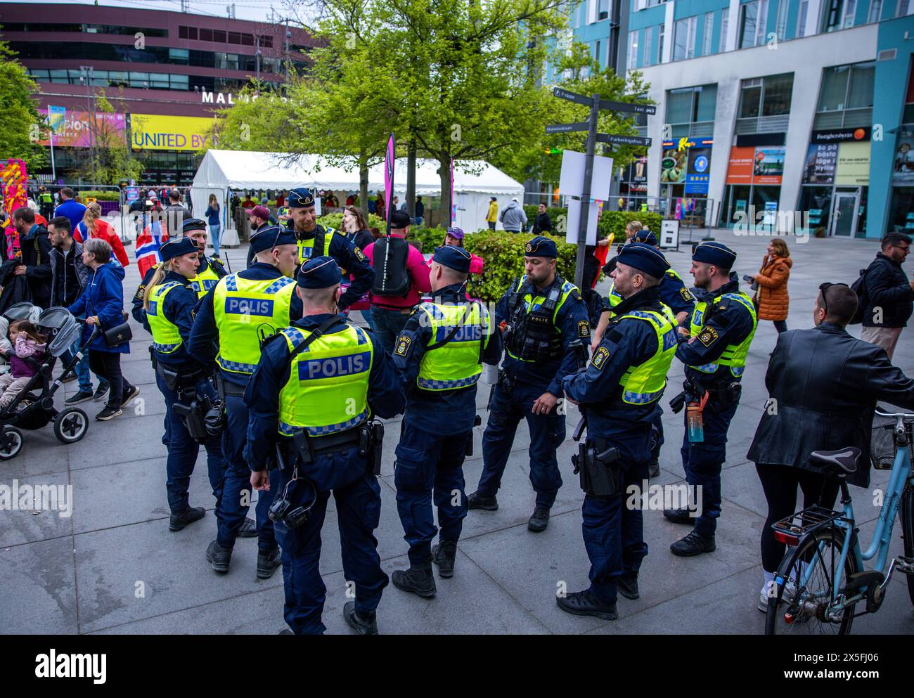 09 May 2024, Sweden, Malmö: Police officers secure the area in front of ...