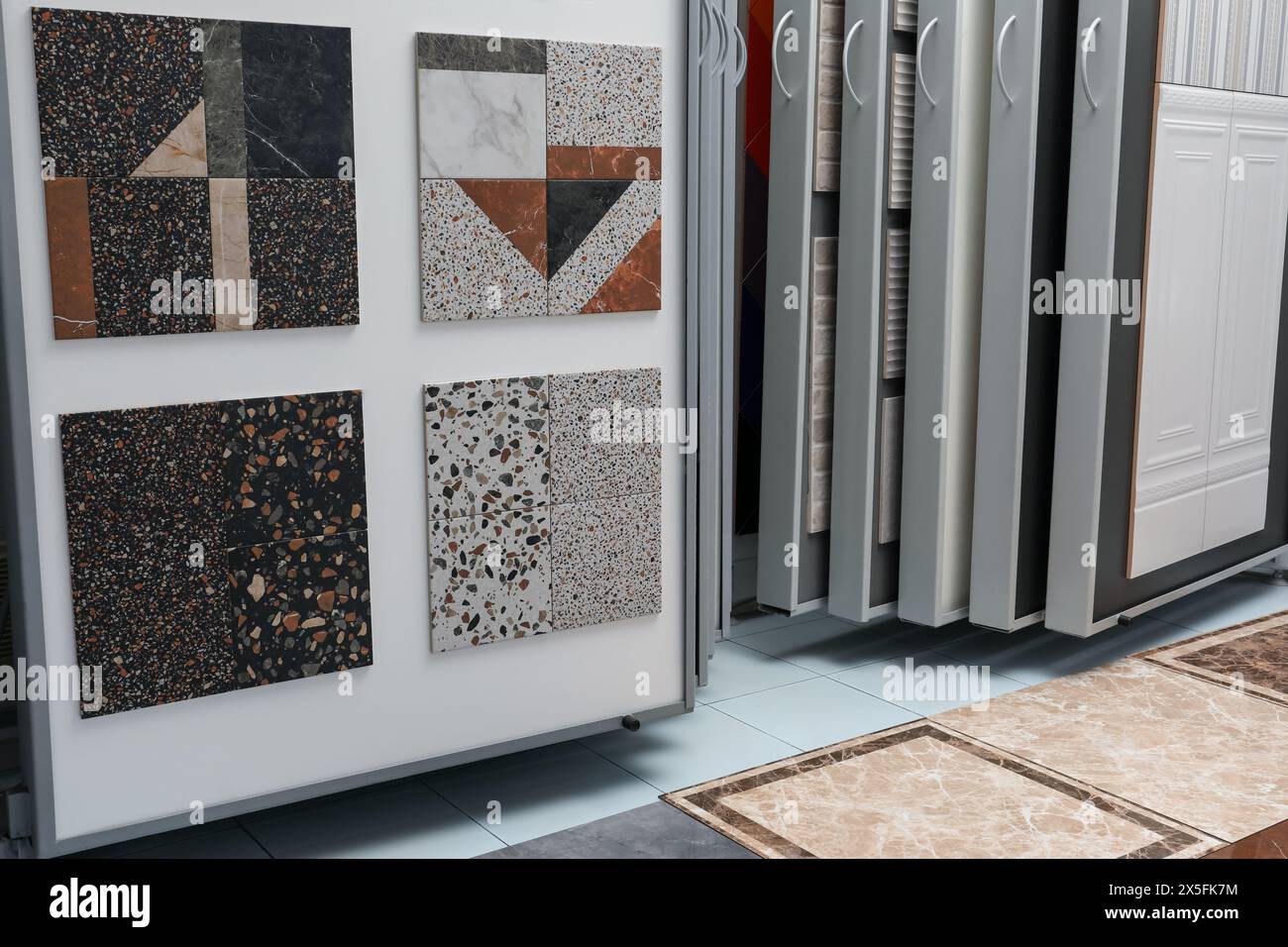 Samples of tiles with different patterns on display in store Stock ...