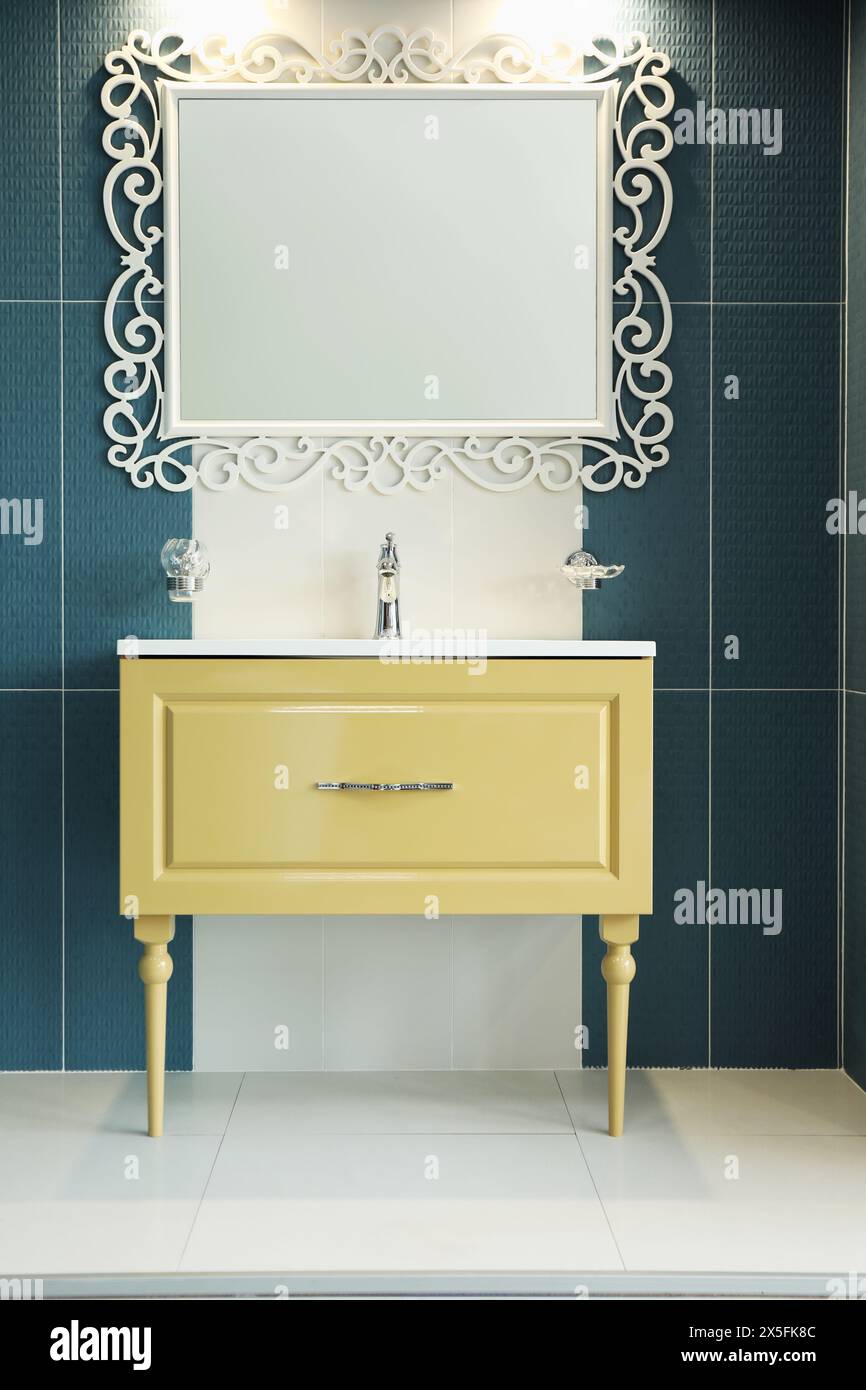 Bathroom interior with mirror and vanity unit on display in store Stock ...