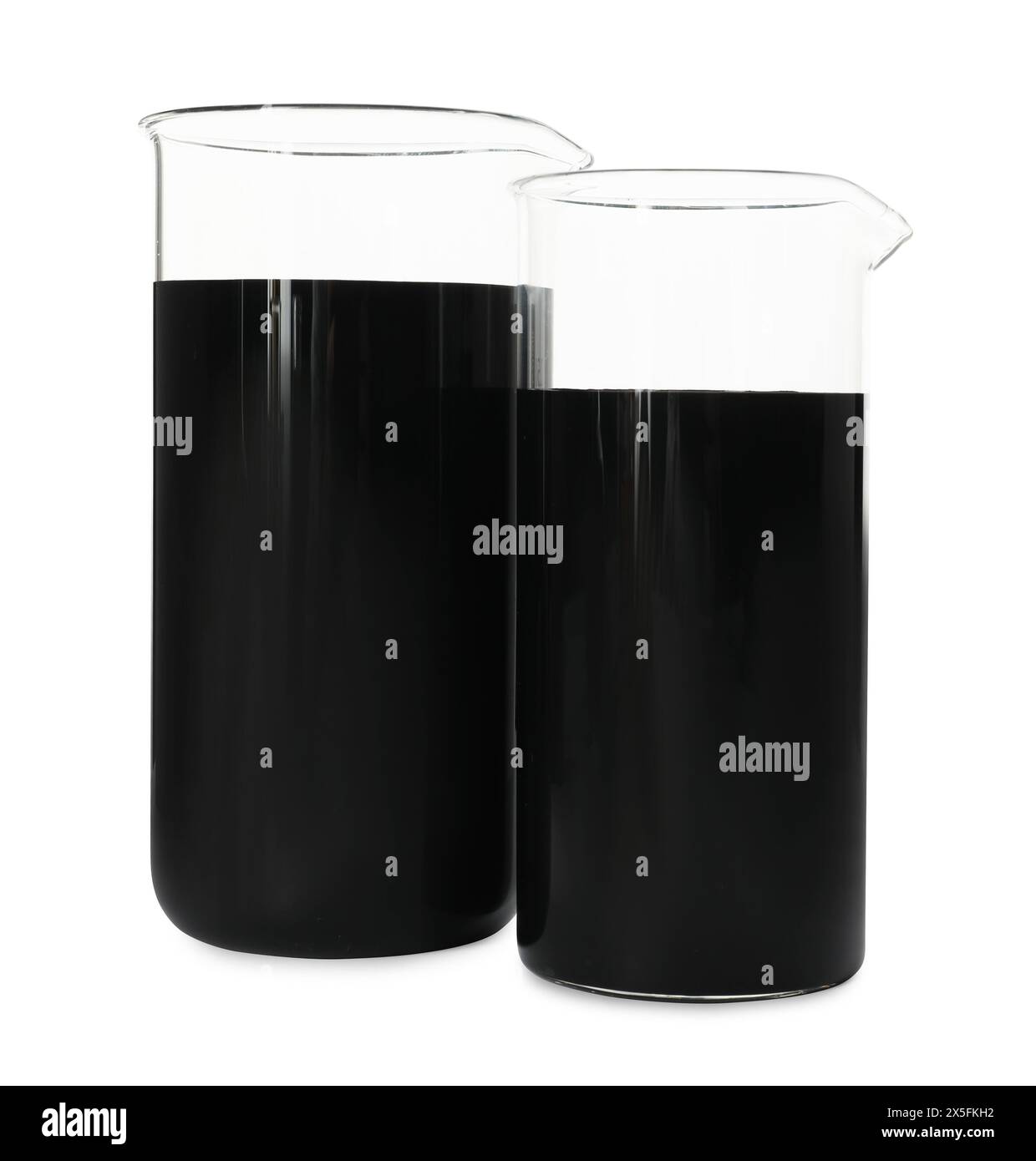 Beakers with black crude oil isolated on white Stock Photo - Alamy