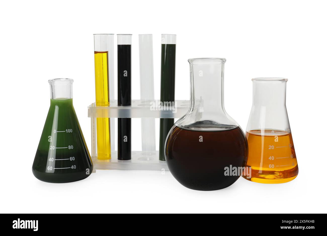 Laboratory glassware with different types of crude oil isolated on ...