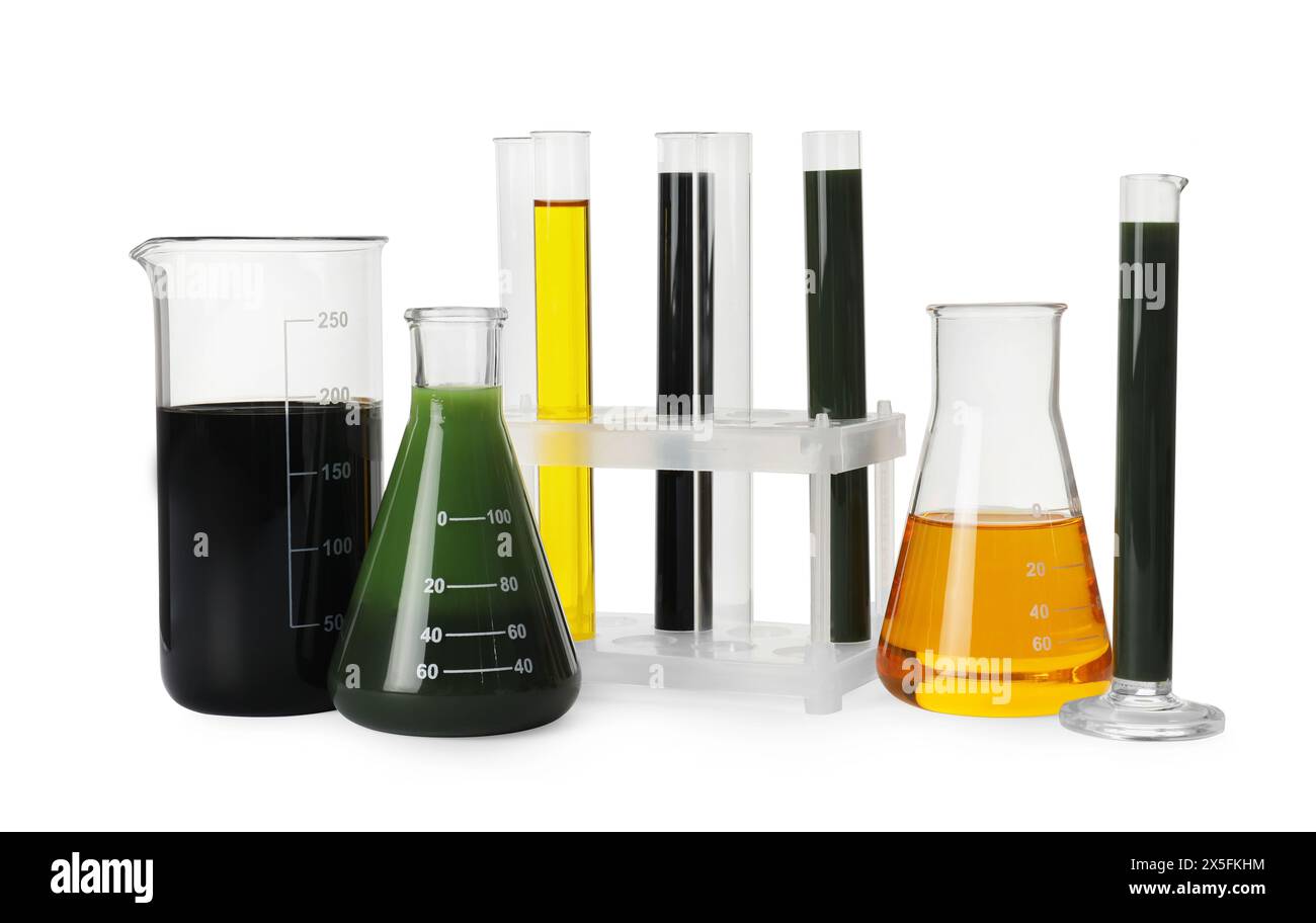 Laboratory glassware with different types of crude oil isolated on ...