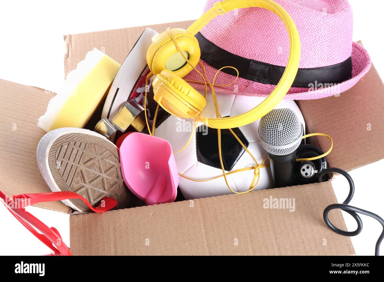 Box of unwanted stuff isolated on white Stock Photo - Alamy