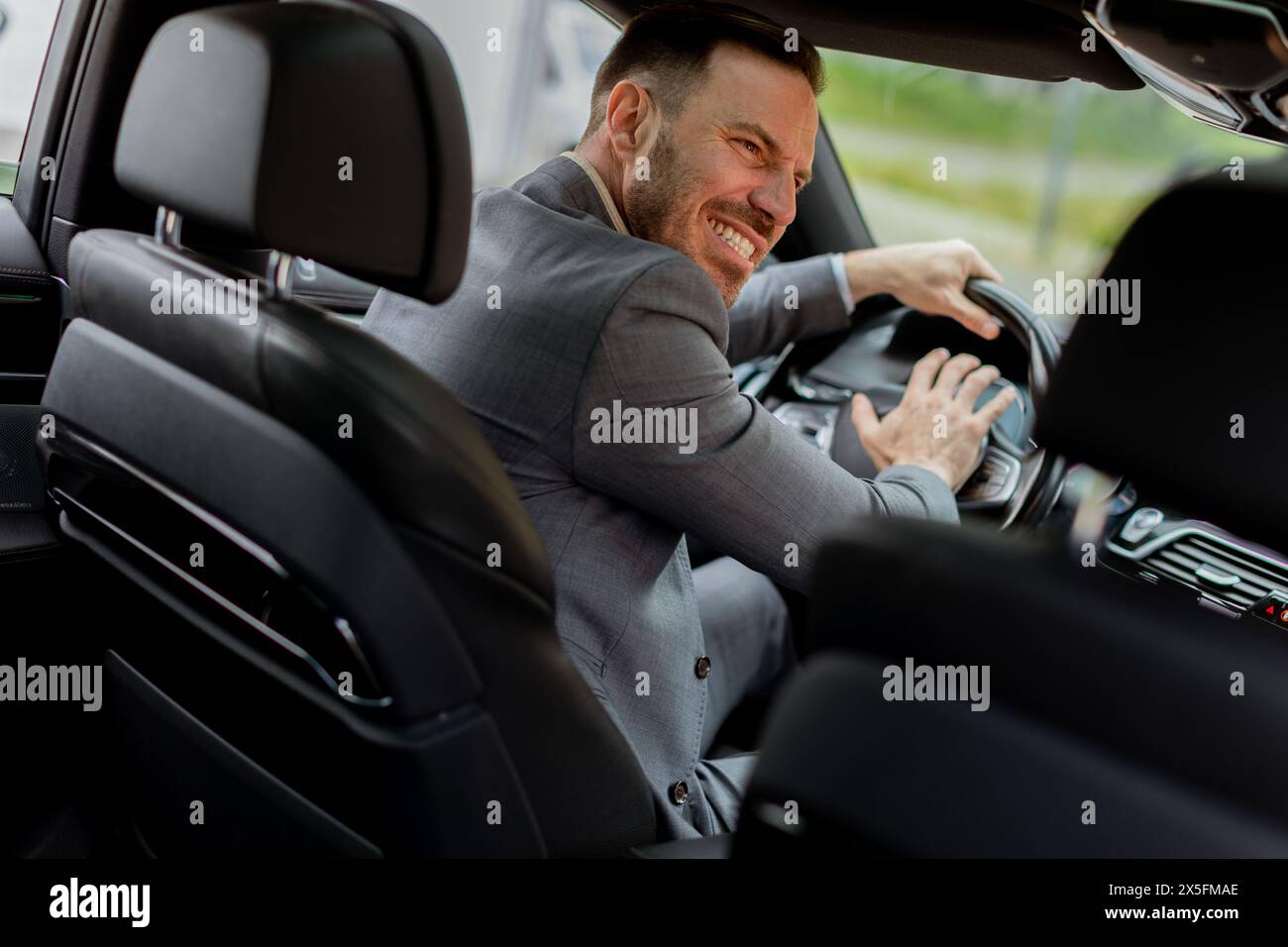 Man in a suit appears to be shouting during traffic jam behind the ...
