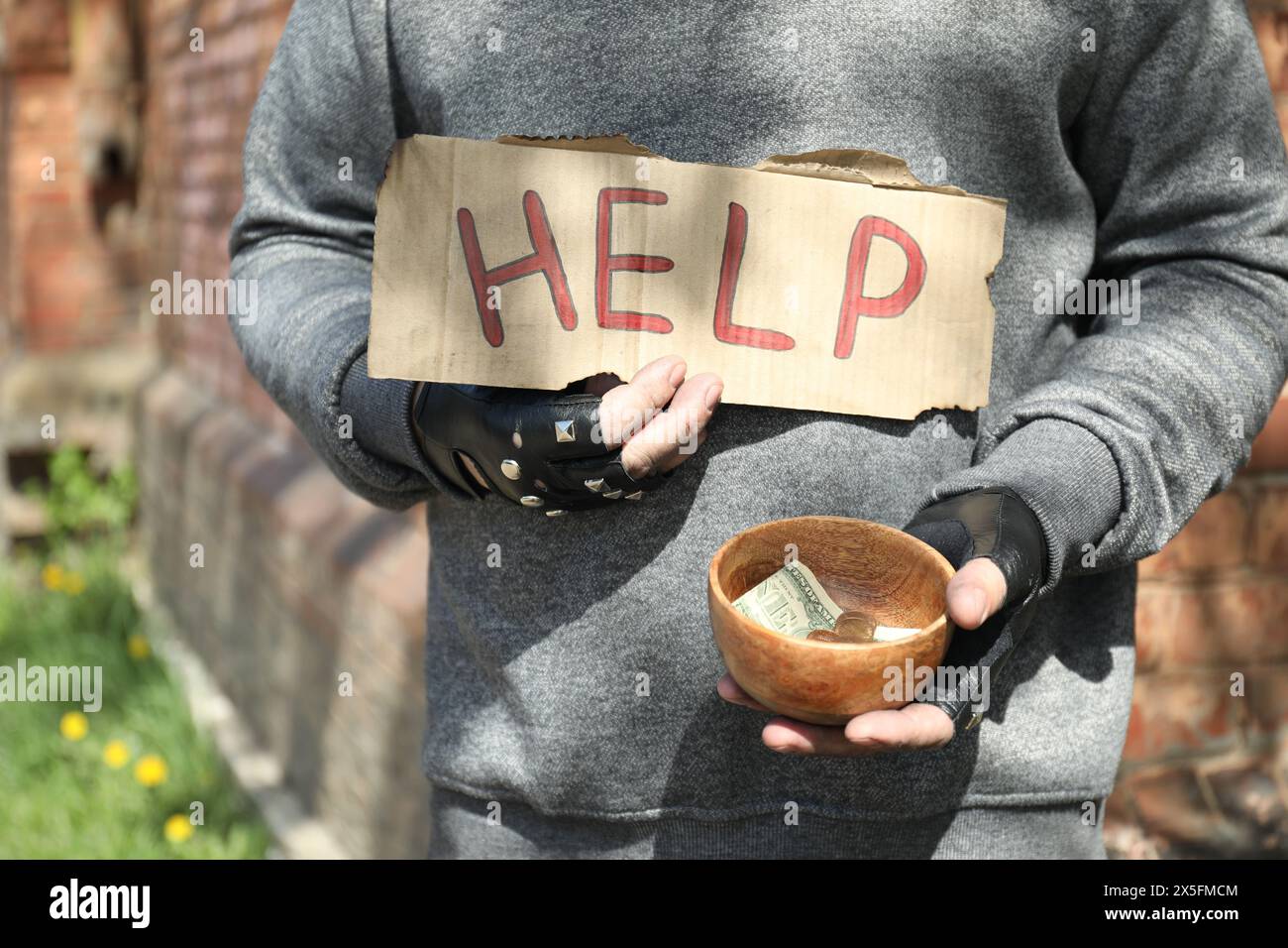 Homeless man holding cardboard sign hi-res stock photography and images ...