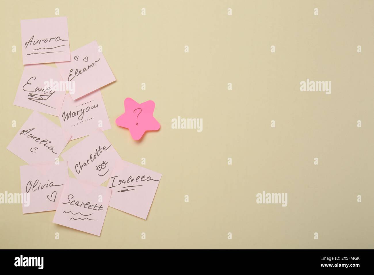 Choosing baby name. Paper stickers with different names and question ...