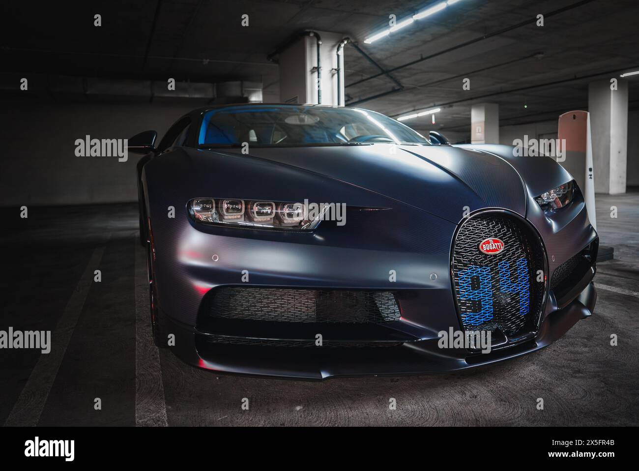 Luxurious Bugatti sports car in dimly lit underground garage, Beverly ...