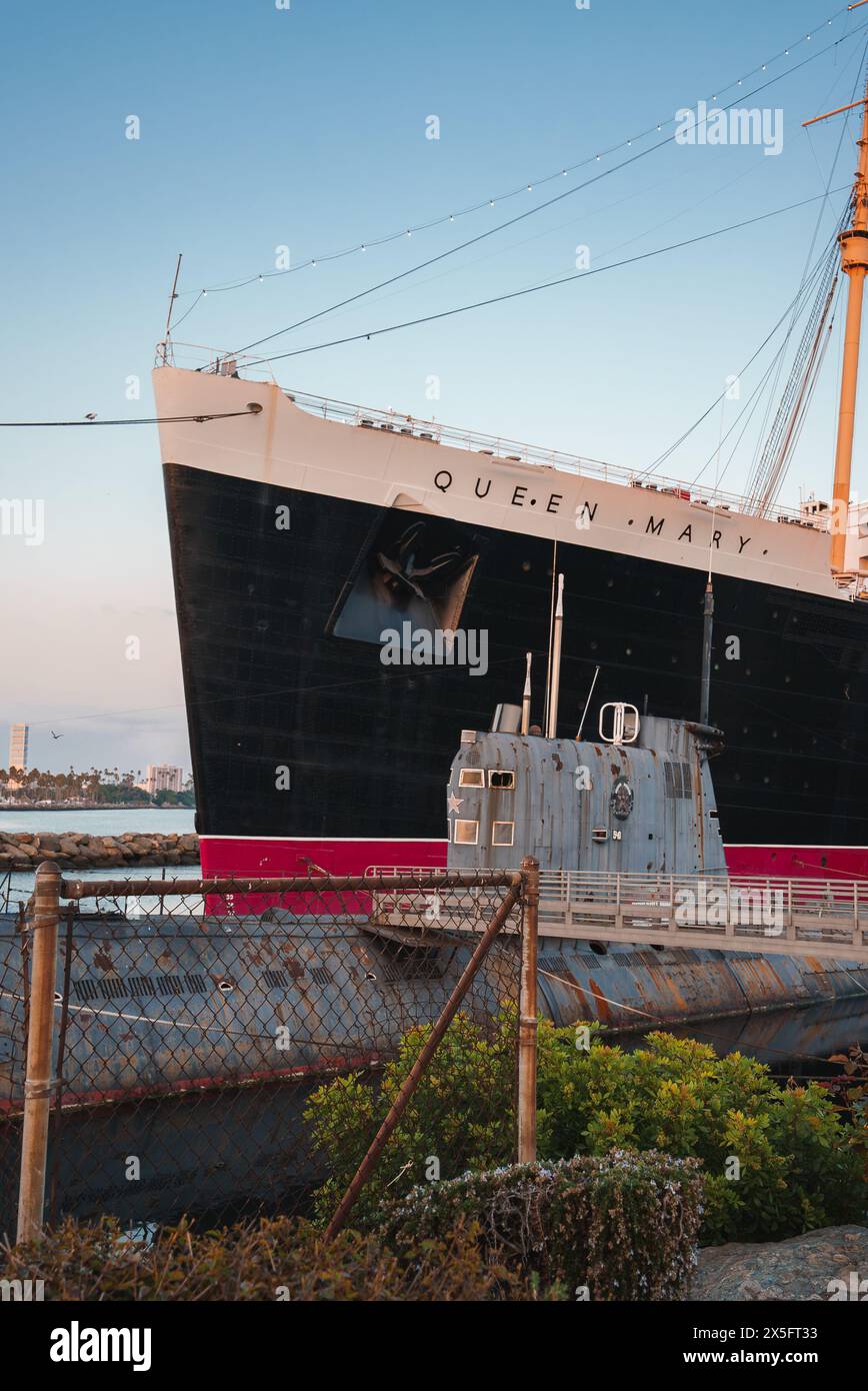 Queen Mary ocean liner at Long Beach, California, at golden hour with ...