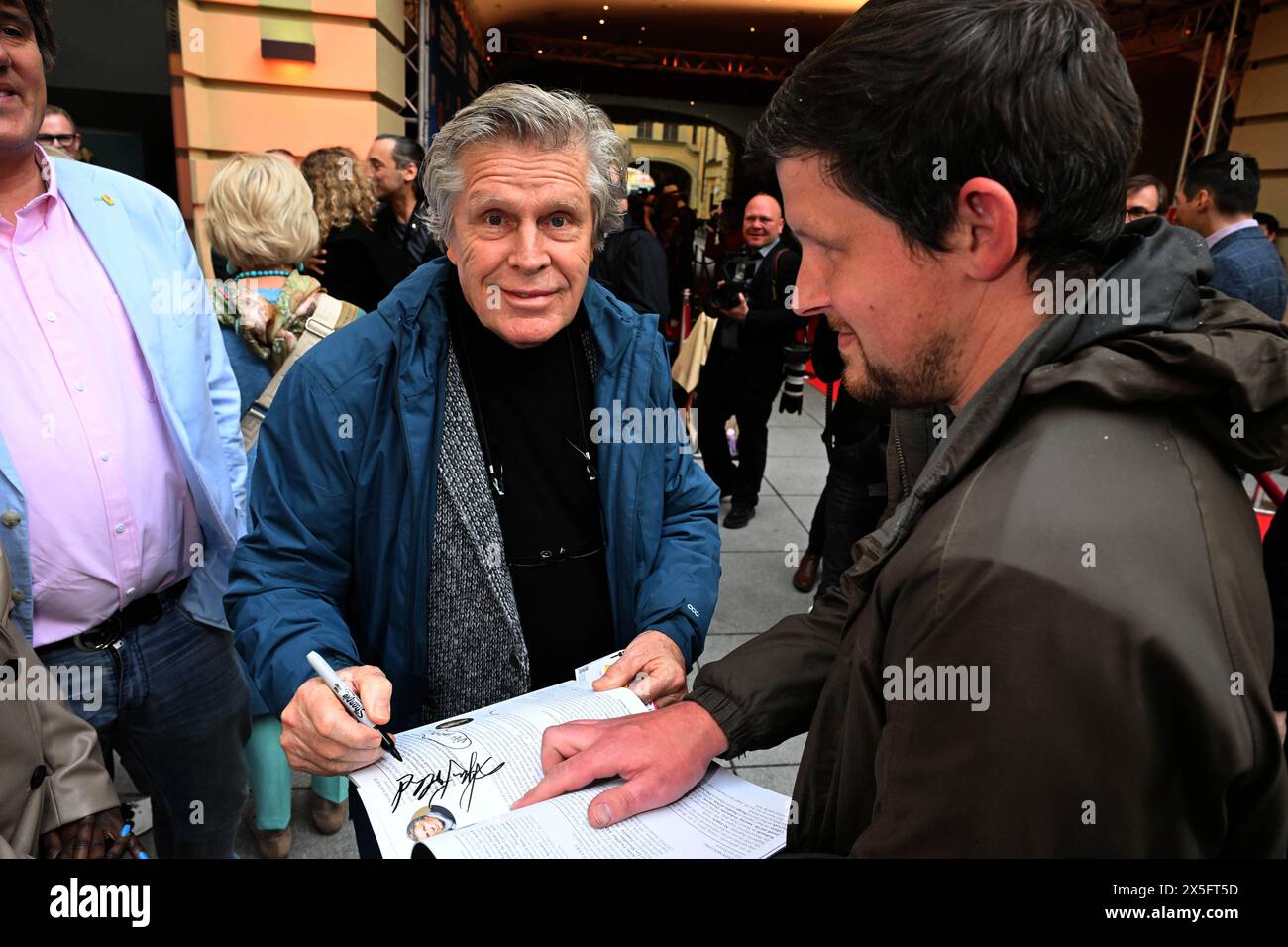Munich, Germany. 09th May, 2024. Actor Sigmar Solbach signs an ...