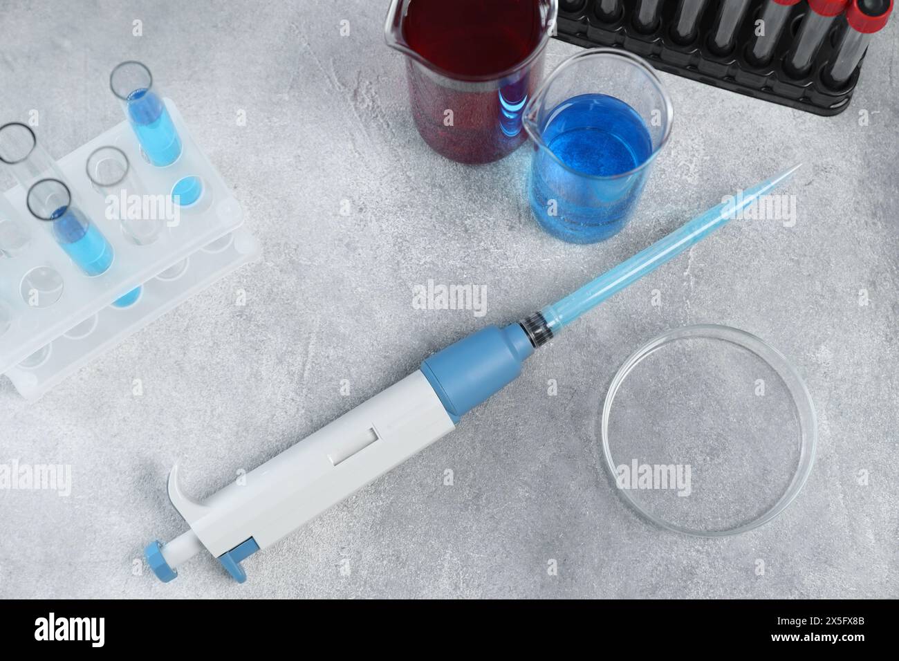 Laboratory analysis. Micropipette, petri dish, beakers and test tubes ...