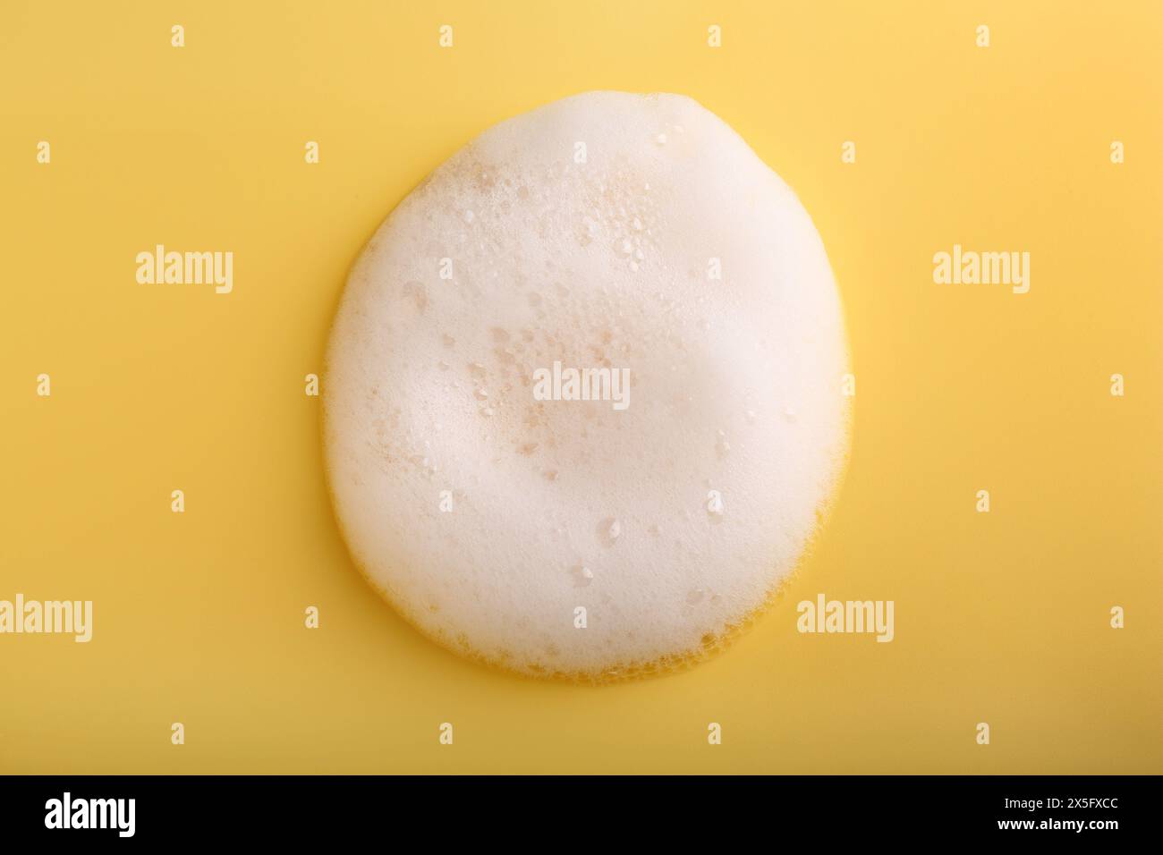Sample of fluffy foam on yellow background, top view Stock Photo - Alamy