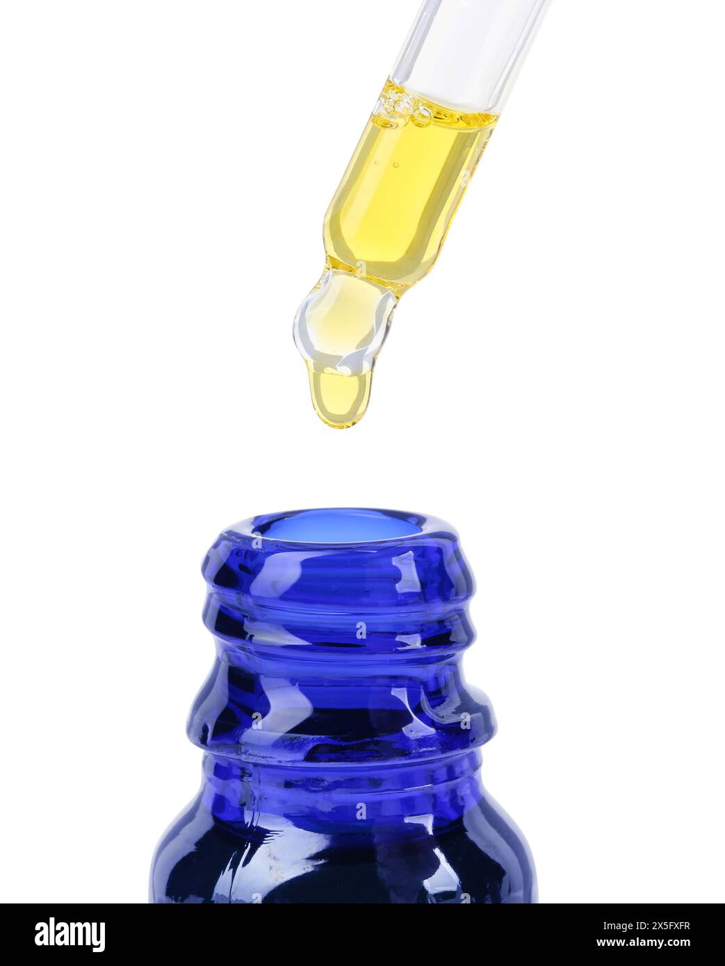 Dripping tincture from pipette into bottle isolated on white Stock ...