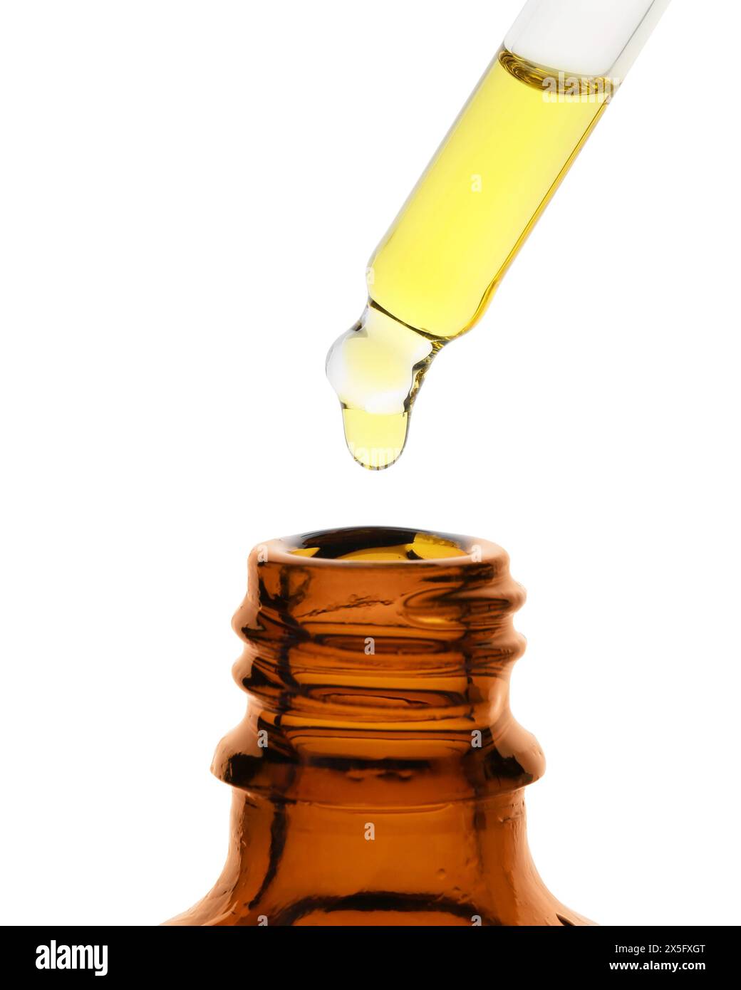 Dripping tincture from pipette into bottle isolated on white Stock ...