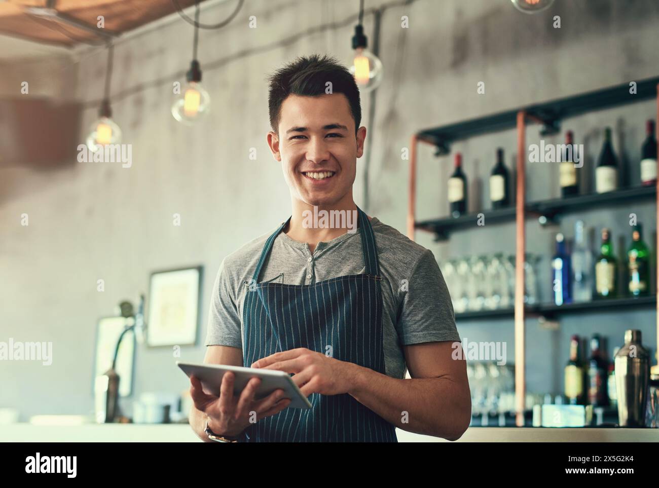Man, tablet and barista portrait in restaurant, typing and waiter for ...