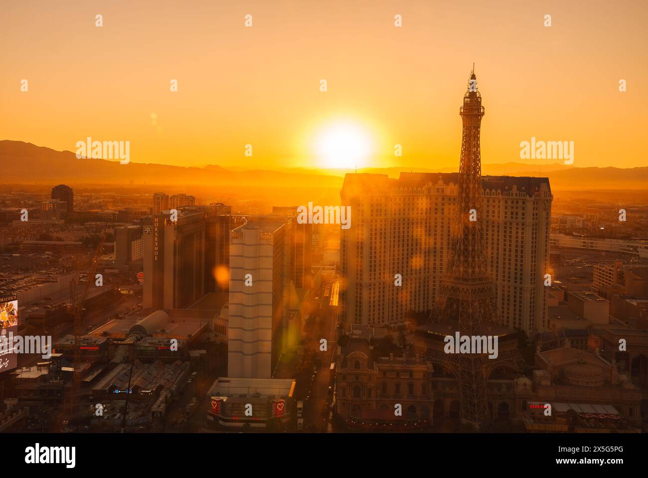 Aerial view of Las Vegas Strip at sunset, highlighting iconic buildings ...