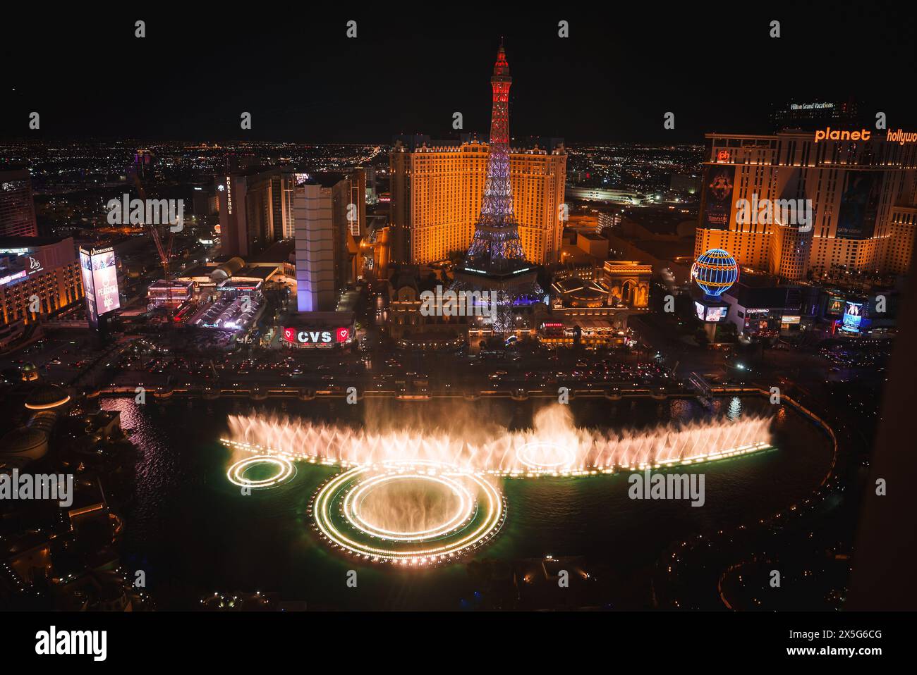 Vibrant Night Scene of Las Vegas Strip, Bellagio Fountains, Eiffel Tower Replica, and City ...