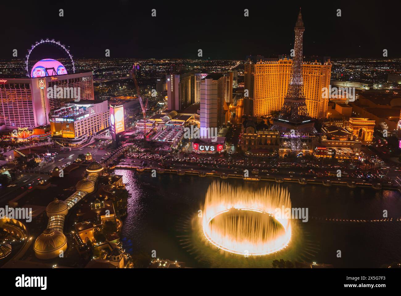 Vibrant aerial view of Las Vegas Strip at night, showcasing iconic landmarks and bustling ...