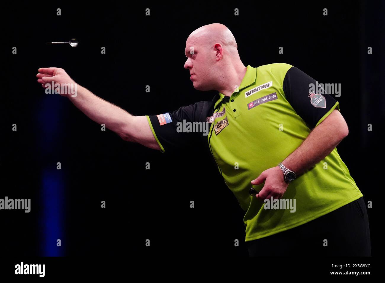 Michael van Gerwen in action against Luke Littler (not pictured) during ...
