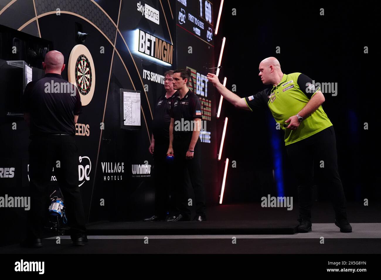 Michael van Gerwen in action against Luke Littler (not pictured) during ...