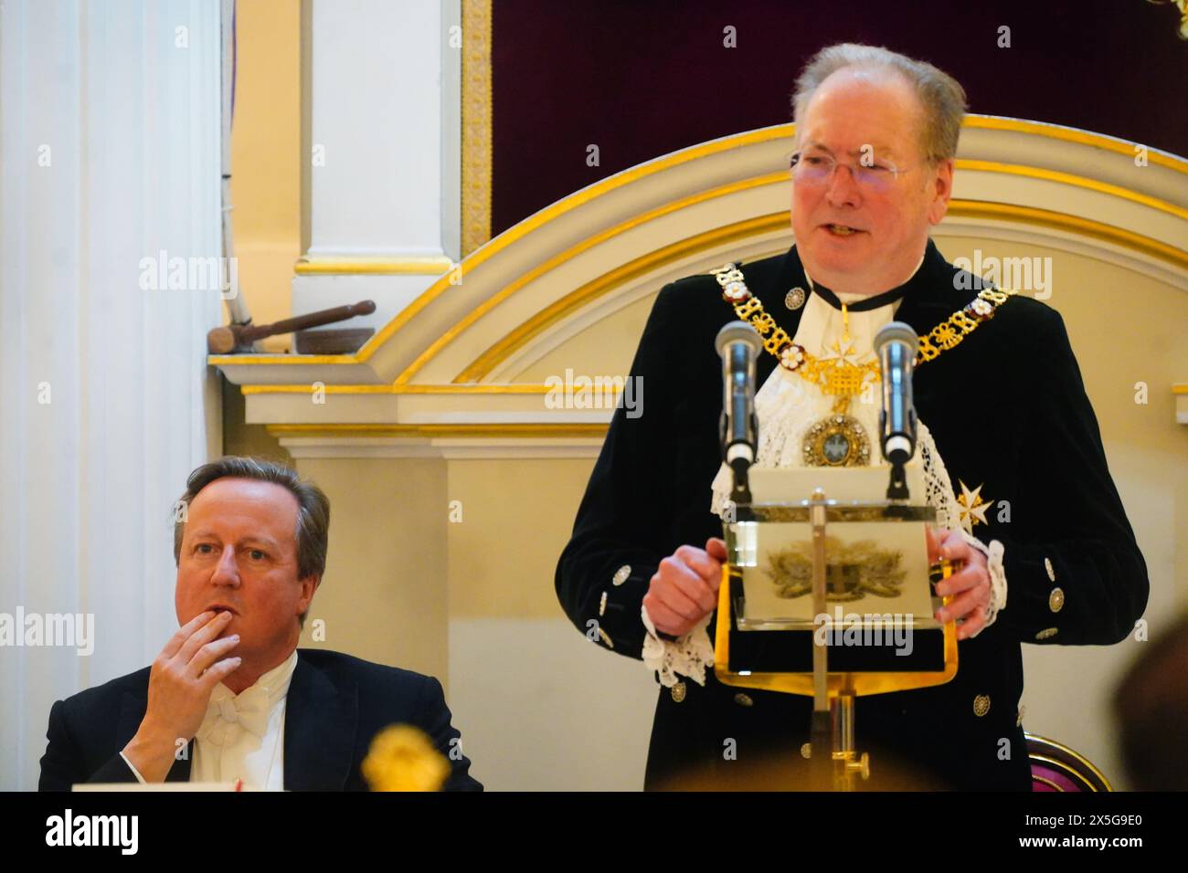 Foreign Secretary Lord David Cameron (left) listens to the Lord Mayor ...