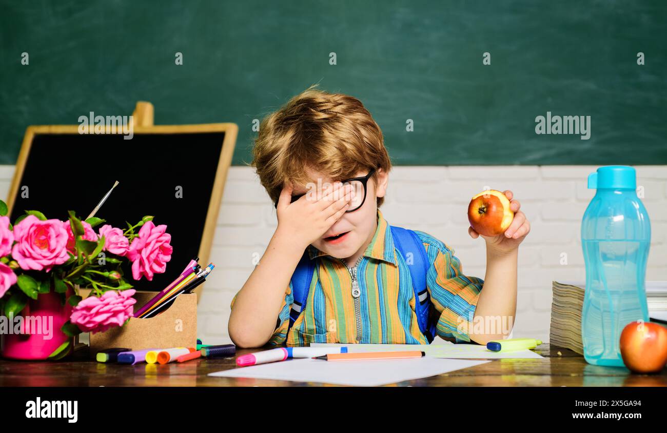 Healthy breakfast or lunch in elementary school. Little schoolboy in ...