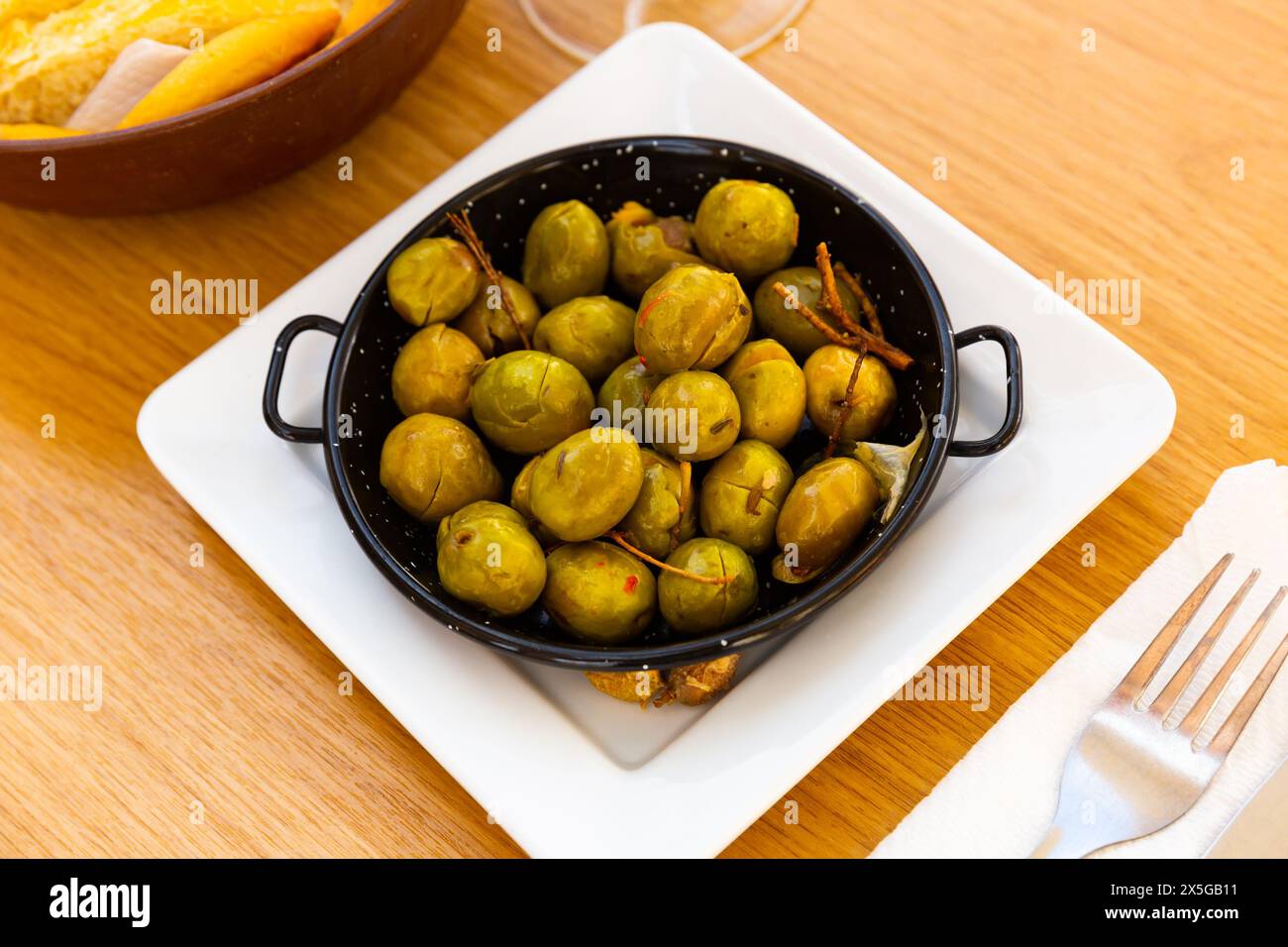 Pickled olives with a stone - a typical Spanish tapas Stock Photo - Alamy