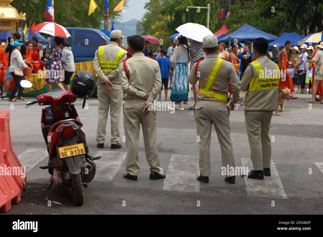 Traffic Police move barriers as part of the Pi Mai Parade, Lao New Year ...