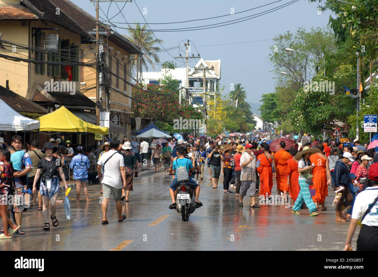 Crowded high street as part of the Pi Mai Parade, Lao New Year Festival ...