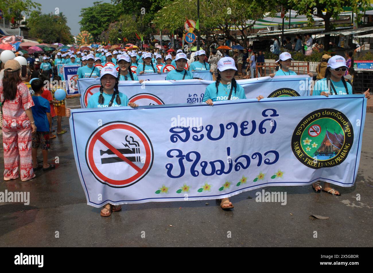 Young people parade as part of the Pi Mai Parade, No Smoking Banner ...