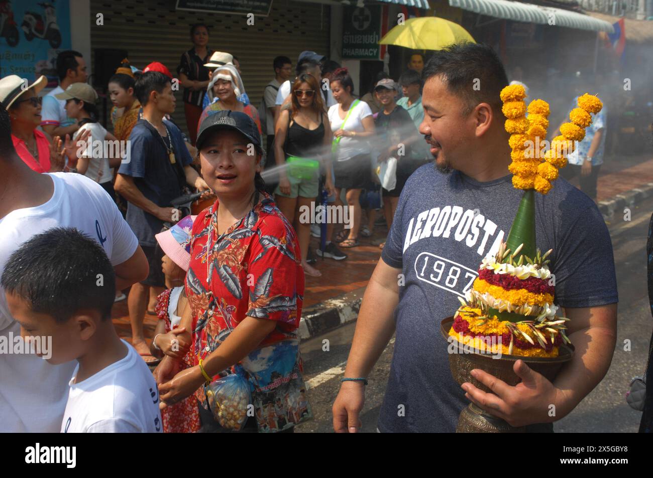 People using hoses and buckets as part of the Pi Mai Parade, Lao New ...