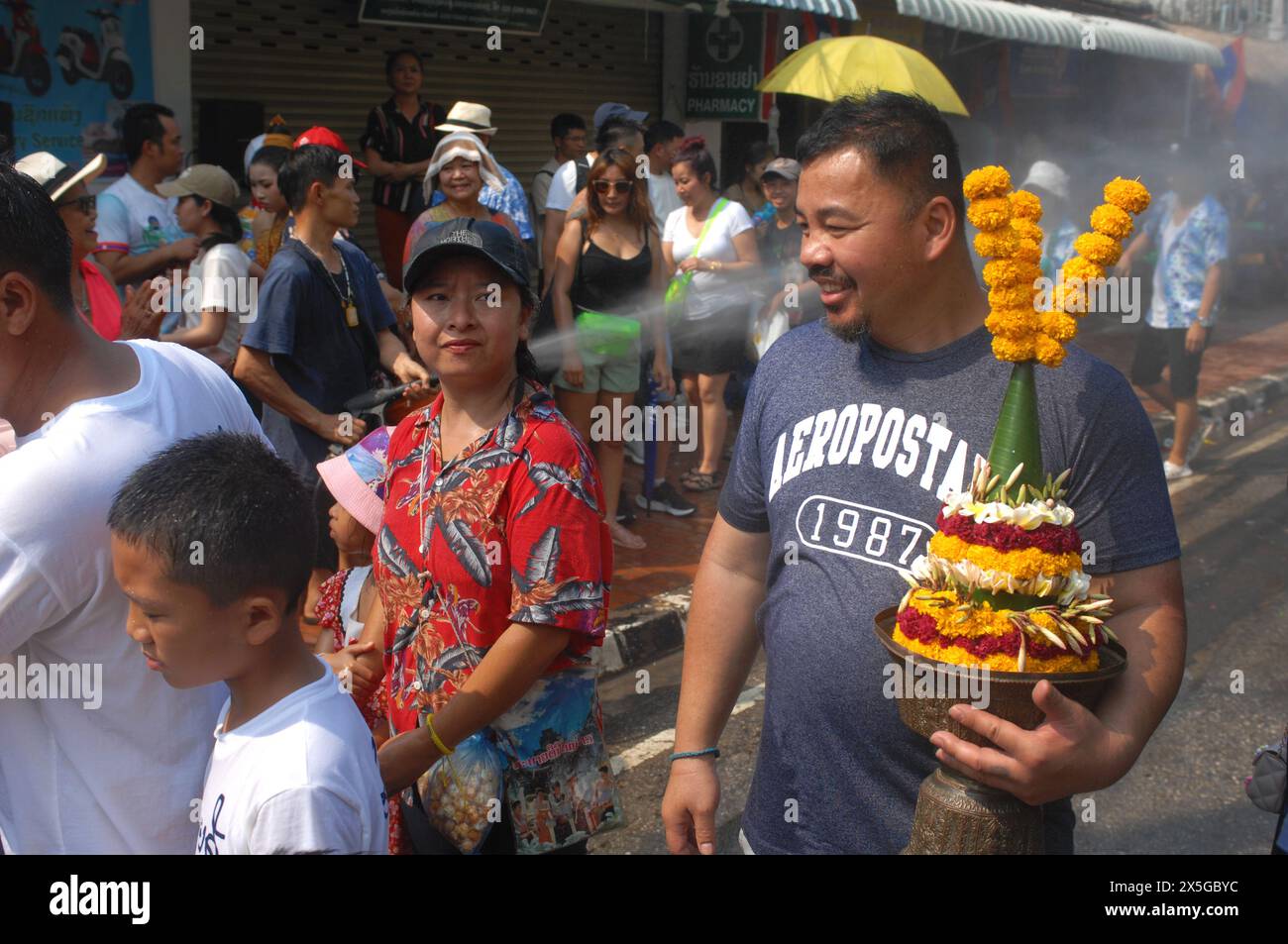 People using hoses and buckets as part of the Pi Mai Parade, Lao New ...