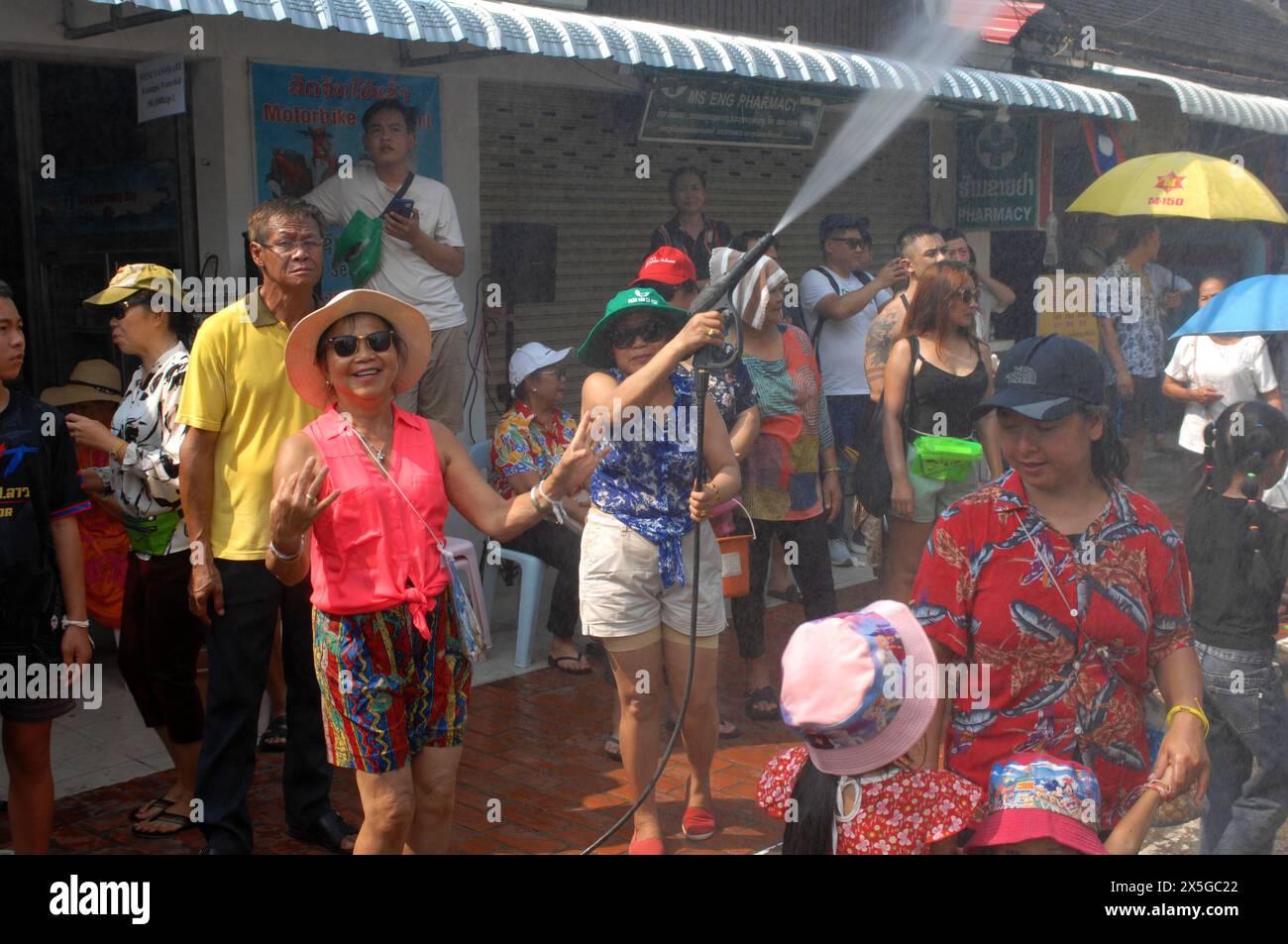 People using hoses and buckets as part of the Pi Mai Parade, Lao New ...