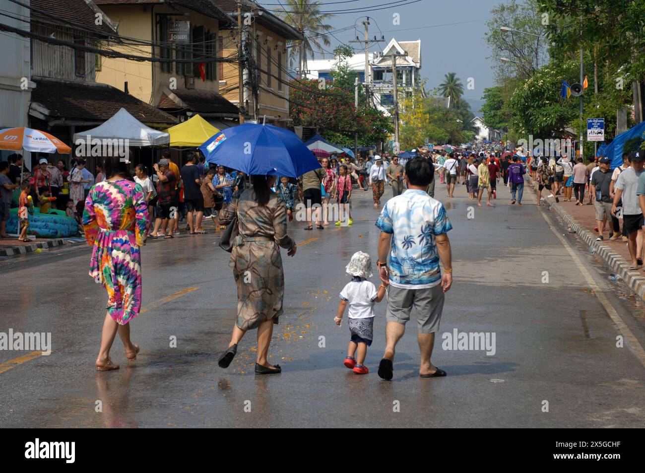 Crowded high street as part of the Pi Mai Parade, Lao New Year Festival ...