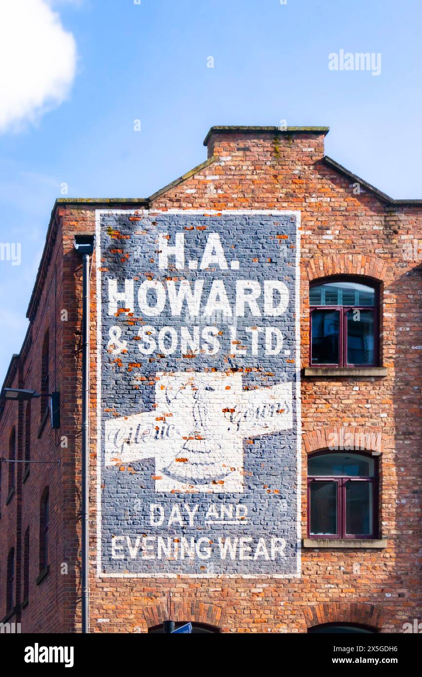 vintage sign painted on brick wall H.A howard day and evening wear ...