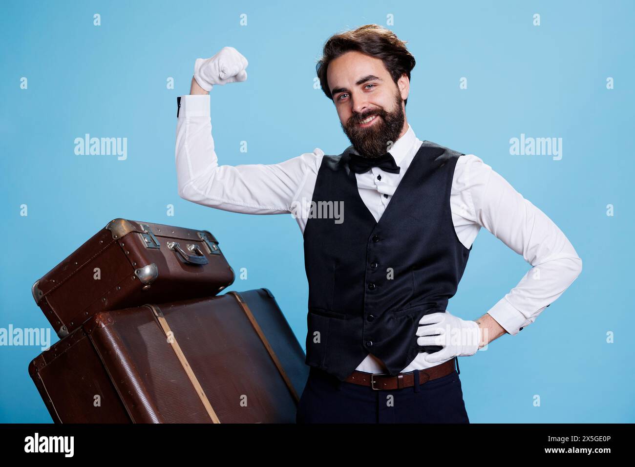 Bellhop shows off his arm muscles on camera, presenting power and force ...