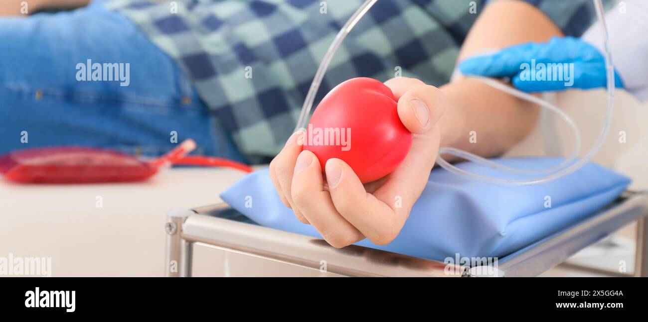 Man donating blood in hospital Stock Photo - Alamy