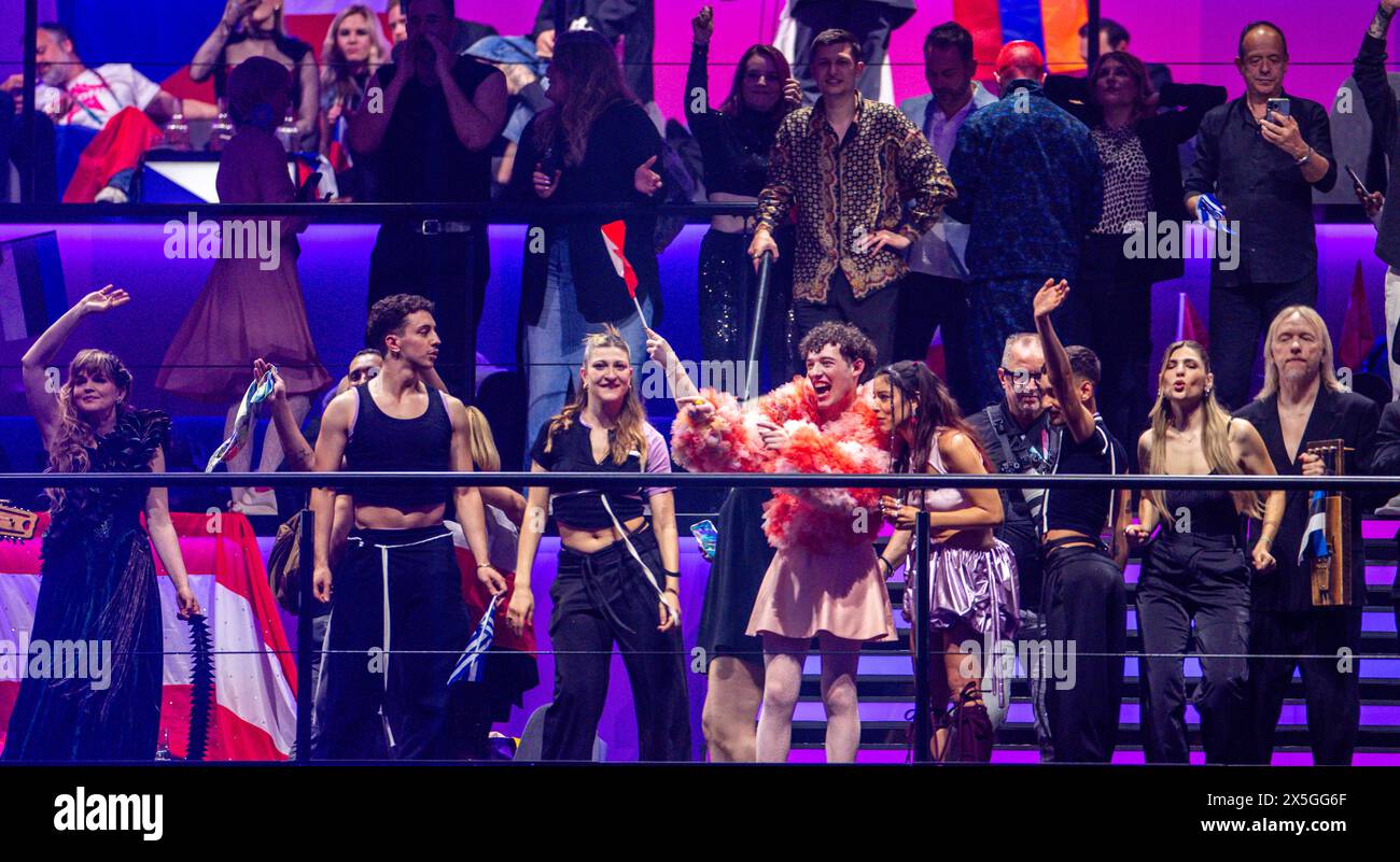 09 May 2024, Sweden, Malmö: Nemo (M) from Switzerland celebrates after ...