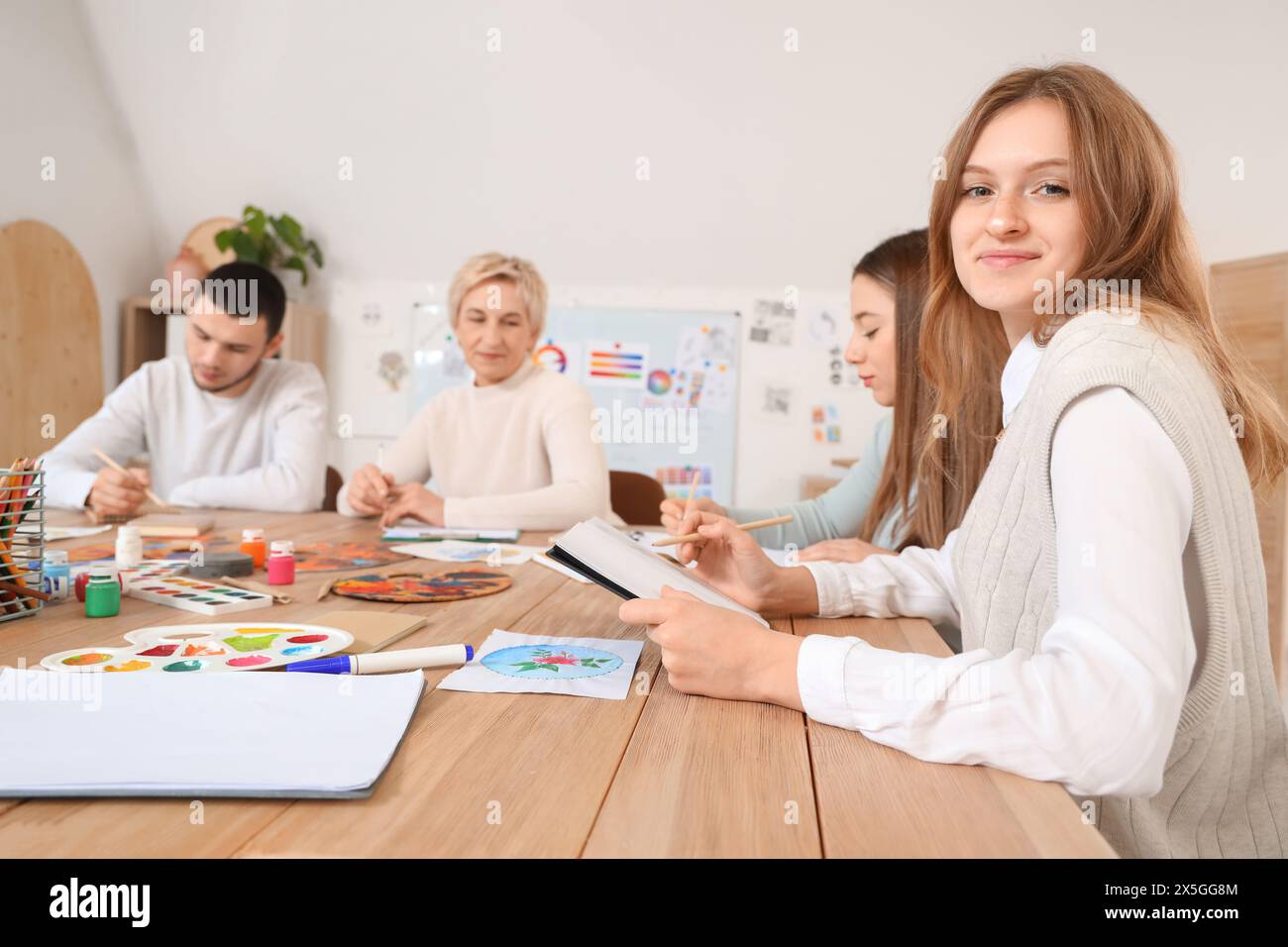 Female student having art lesson at school Stock Photo - Alamy