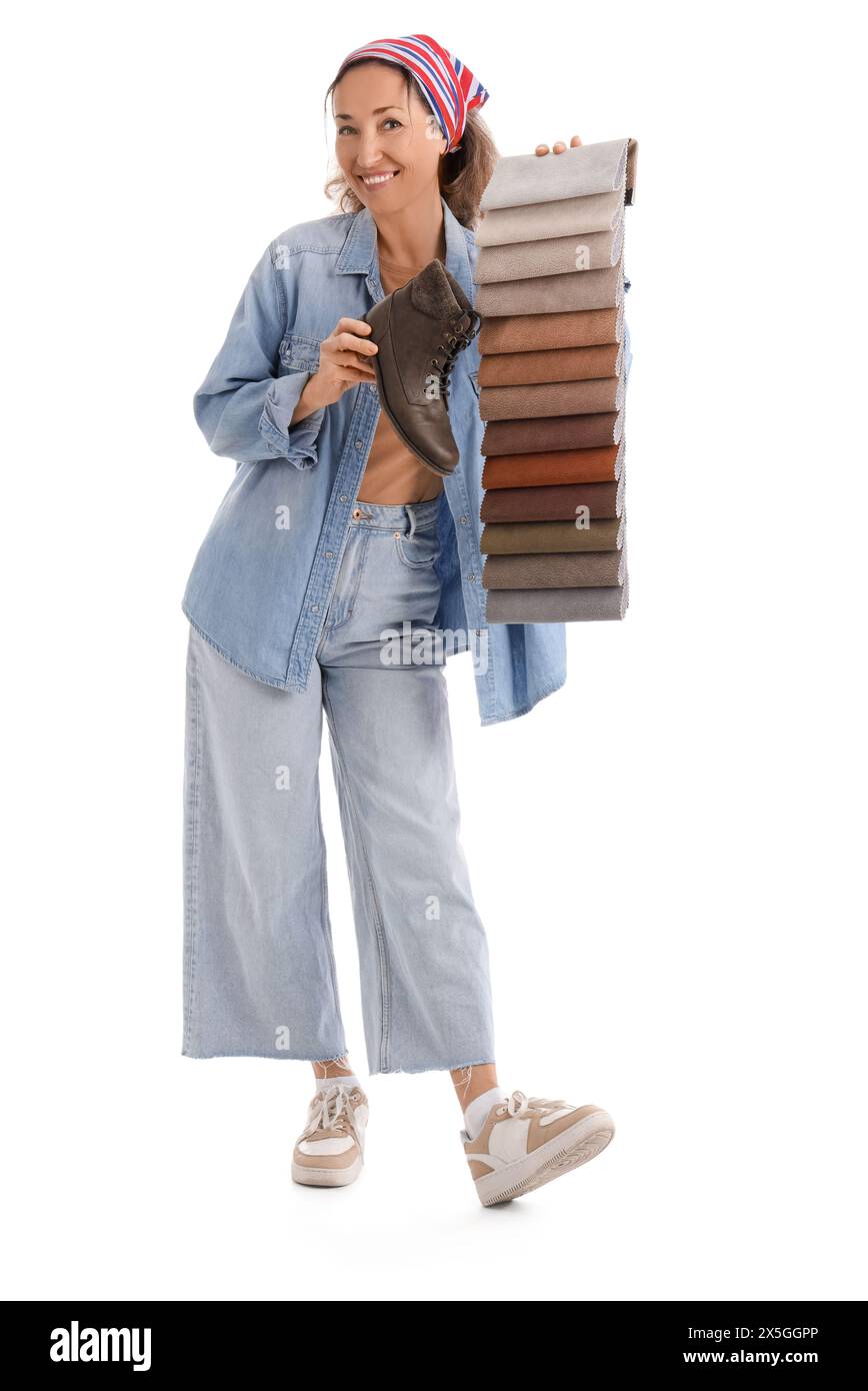 Happy female shoemaker with boot and fabric samples on white background ...