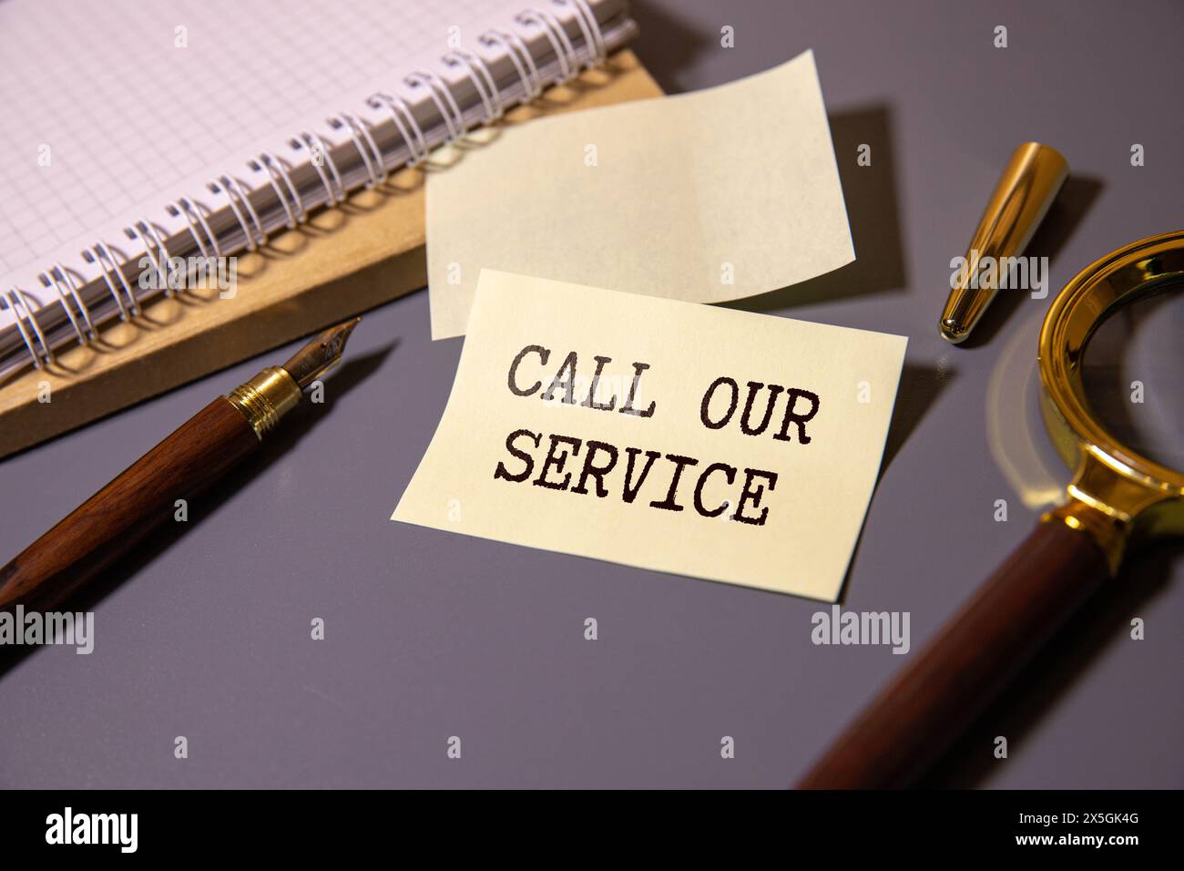 Our services symbol. Old blue rotary dial telephone. Words 'our ...