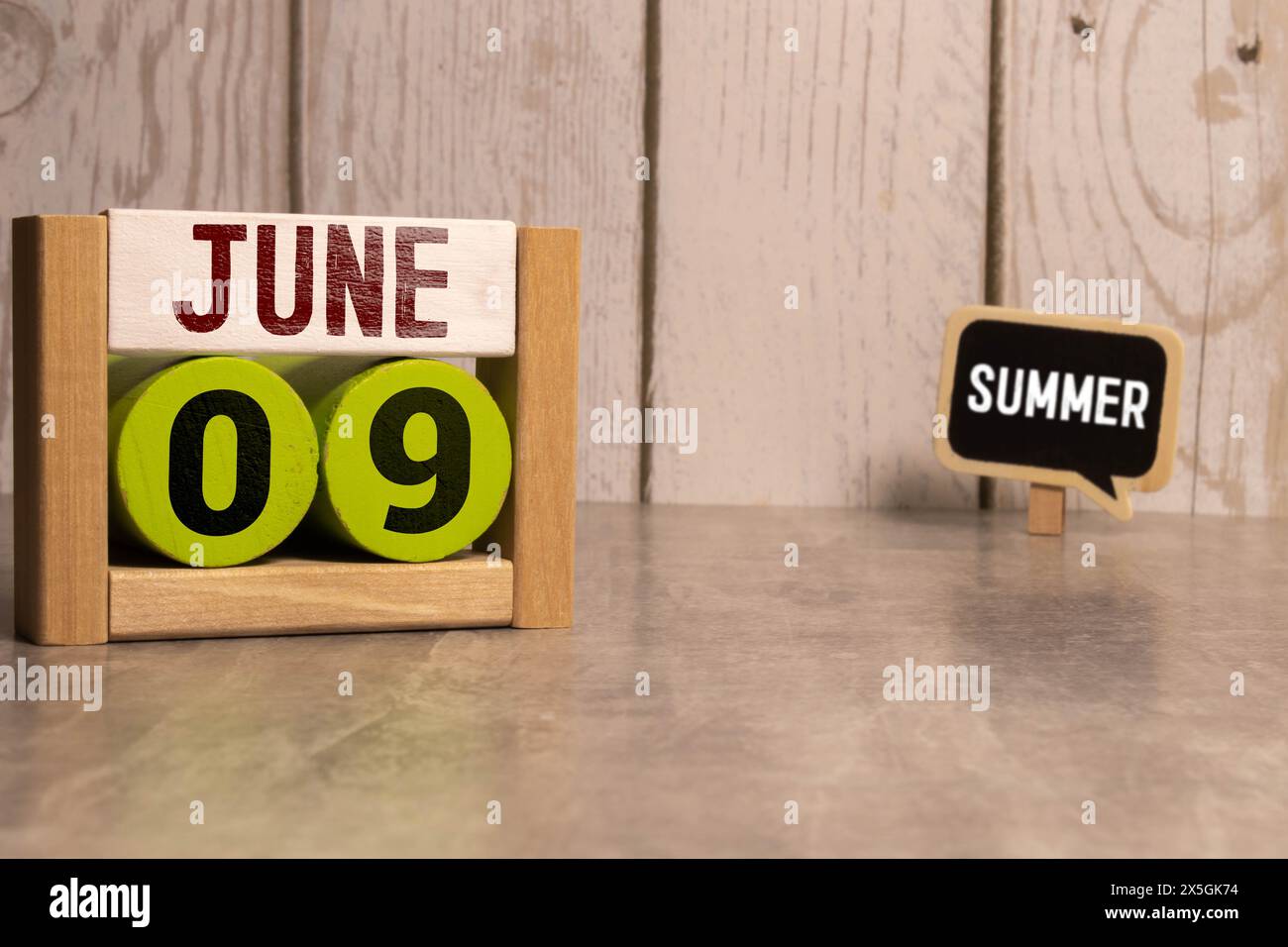 June 09th. Day 9 of month. Calendar cube on modern pink background ...